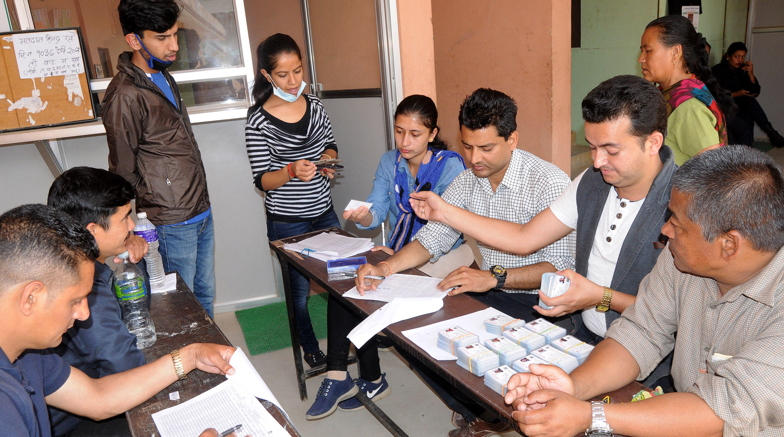 EC starts distributing voter ID cards (In photos)