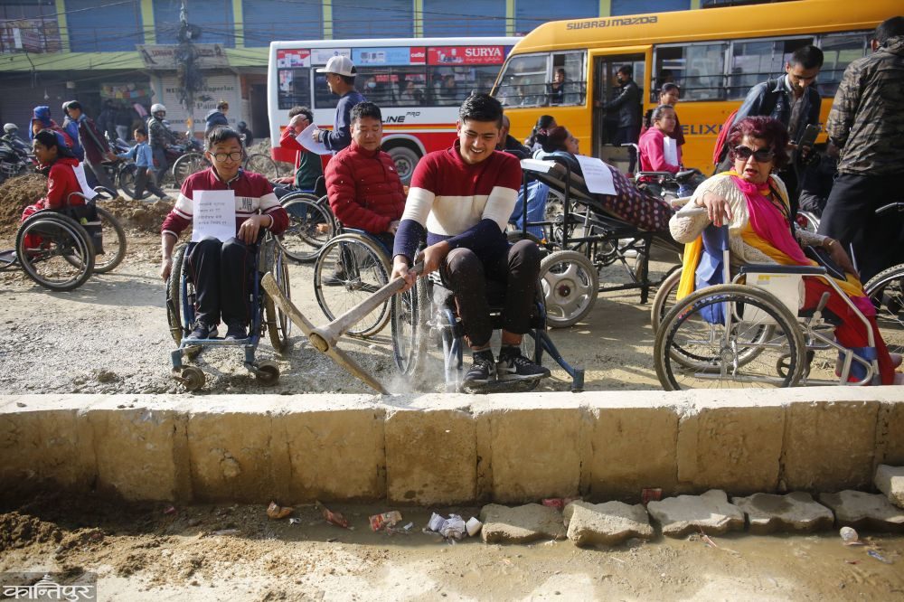 People in wheelchairs pull down recently built sidewalks, demand ...