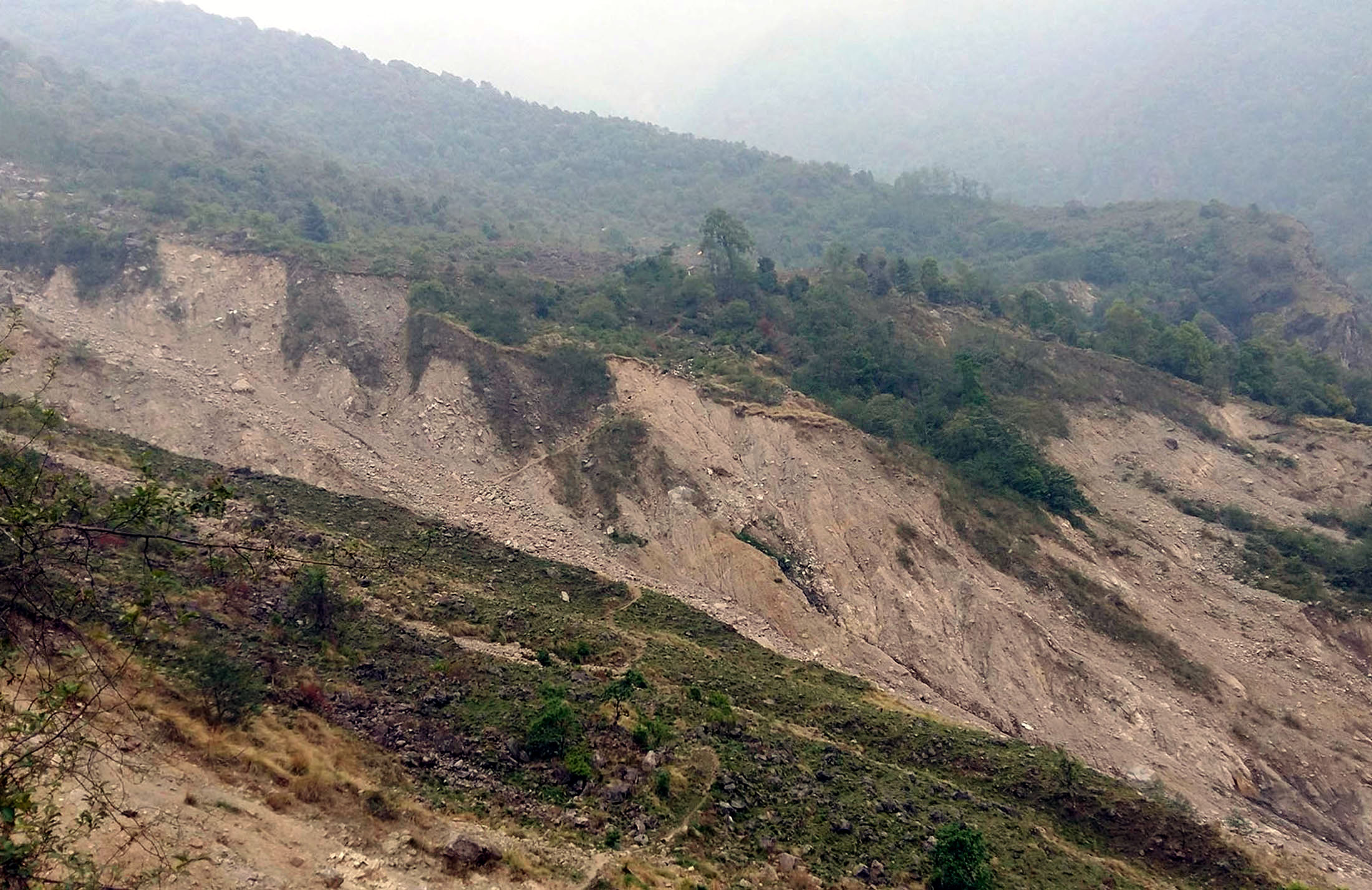 How a three-decade old landslide is displacing a whole village