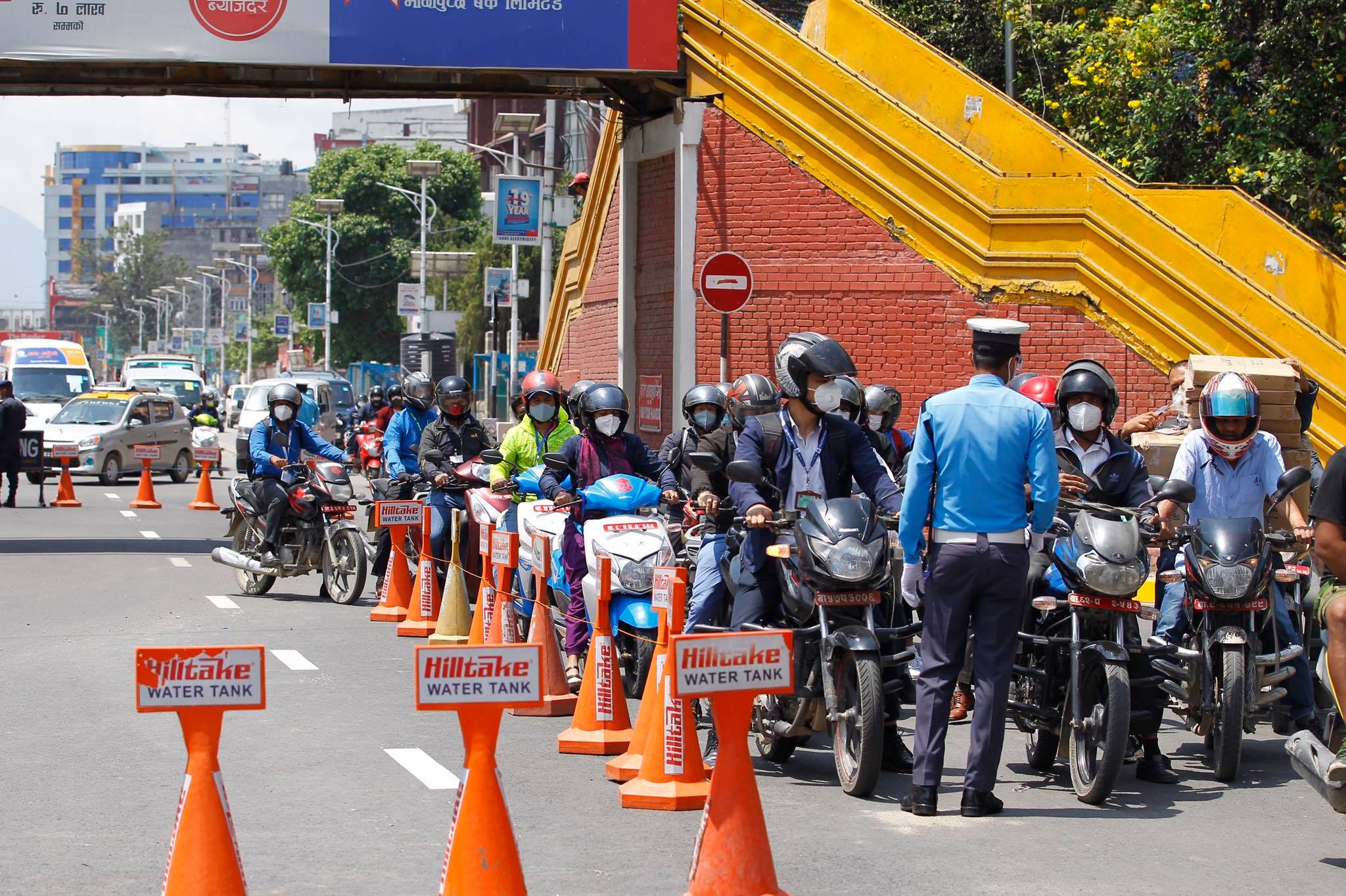 Traffic police in Kathmandu stop motorists for flouting lockdown ...